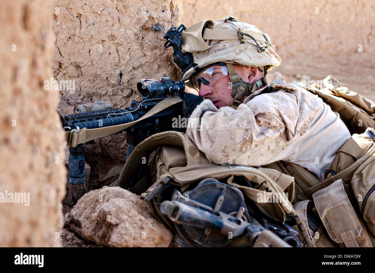 A US Marine provides supporting cover fire during a firefight with ...