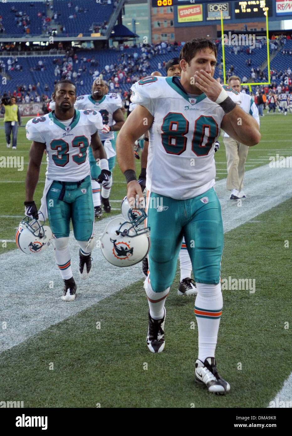 dolphins-patriots-s110809. Anthony Fasano walks off the field after the ...