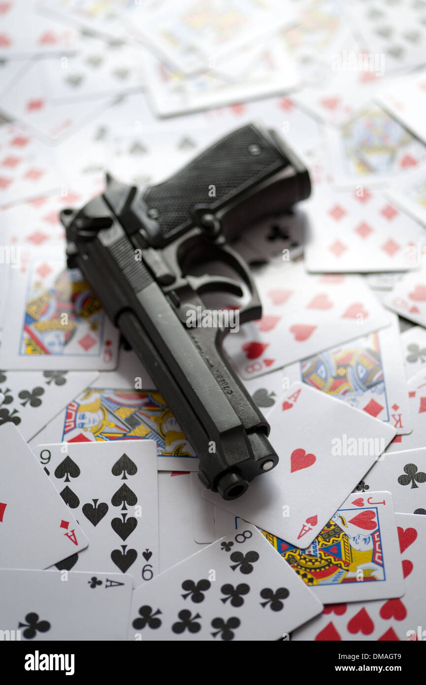 gun and playing cards Stock Photo - Alamy
