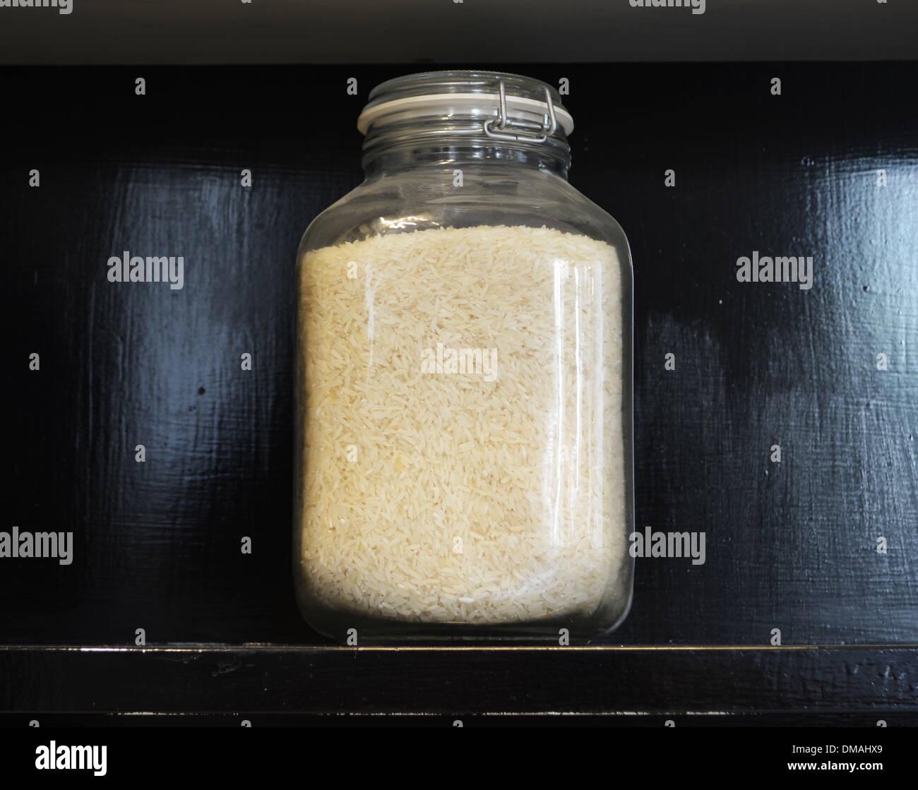 Rice Jar on a Black Shelf Stock Photo - Alamy