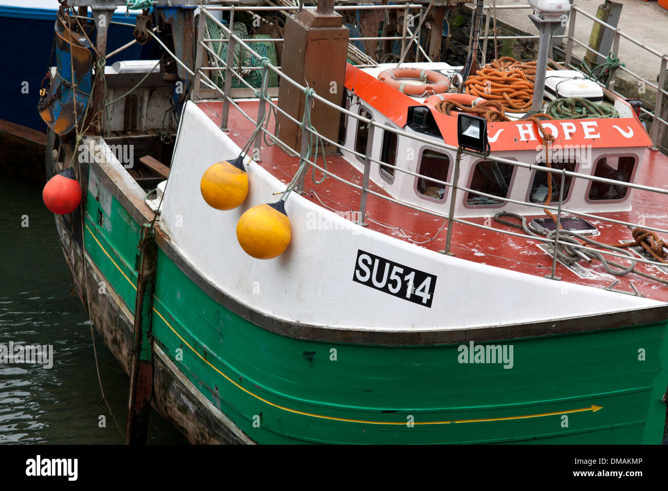 Colorful fishing boat in the harbor of Polperro, a famous and popular ...