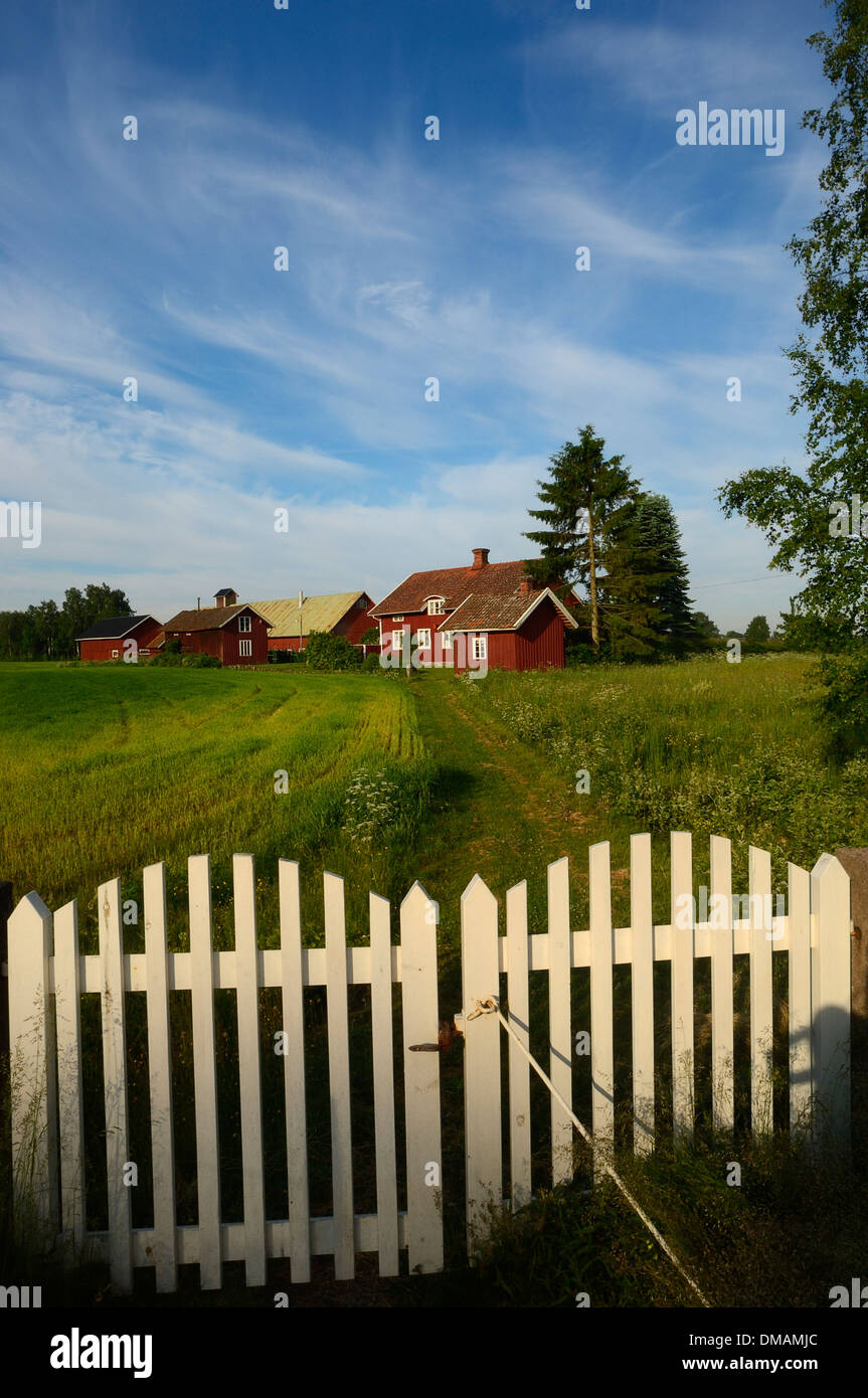 Typical Swedish red coloured farmhouse beside the Gota Canal. Sweden ...