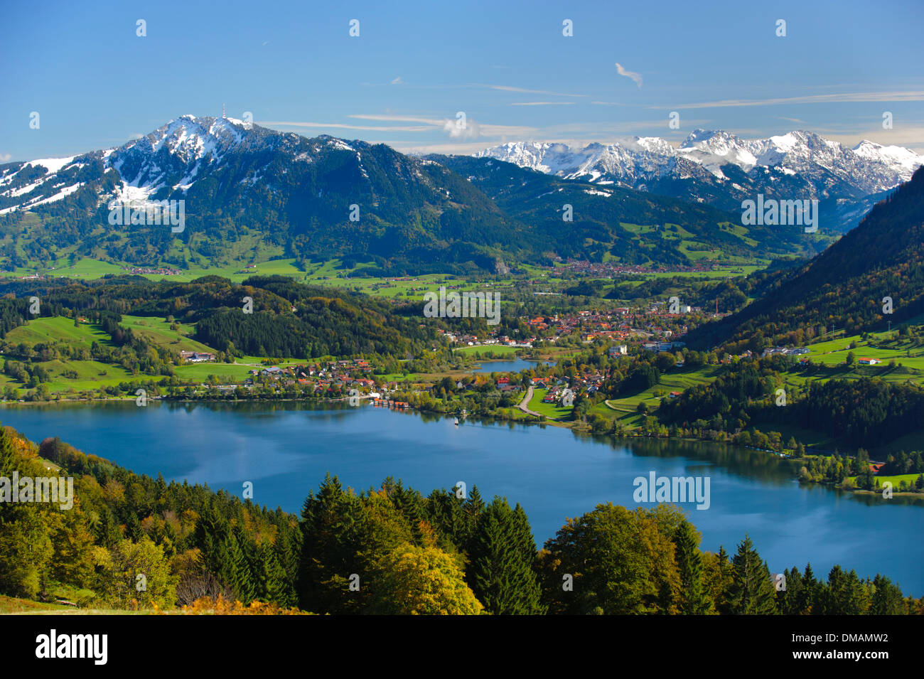 rural panorama landscape with lake Alpsee and alps mountains in Bavaria ...