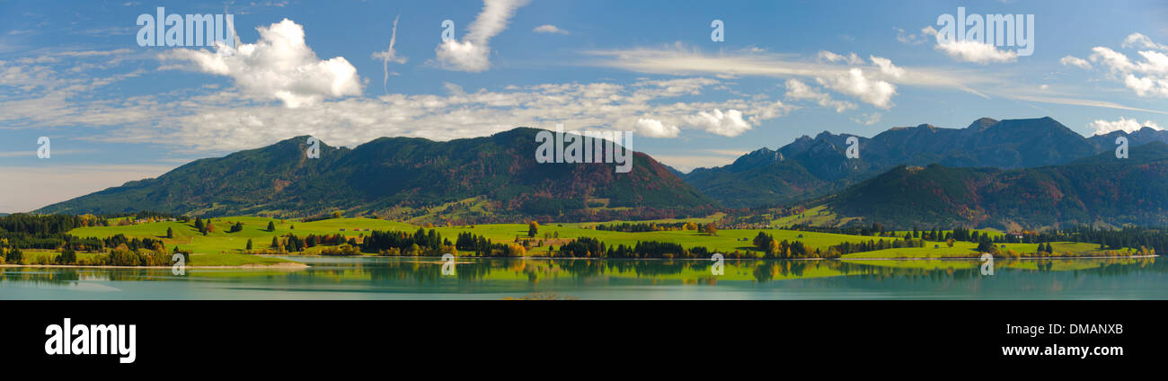 rural panorama landscape with lake Forggensee and alps mountains in ...