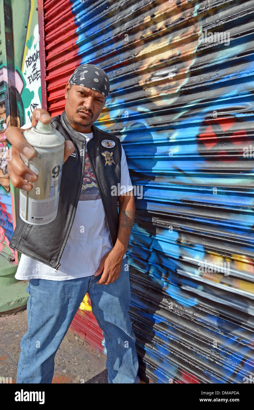 Portrait of a graffiti artist in front of his art at 5 Pointz in Ling ...