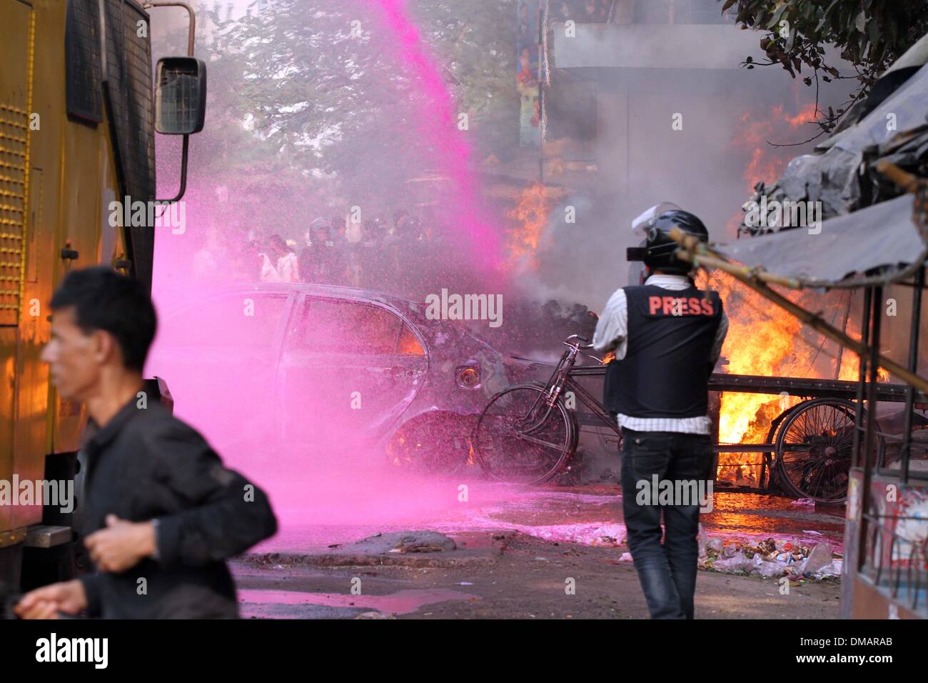 Dhaka, Bangladesh. 13th December 2013. An unseen Bangladeshi police ...
