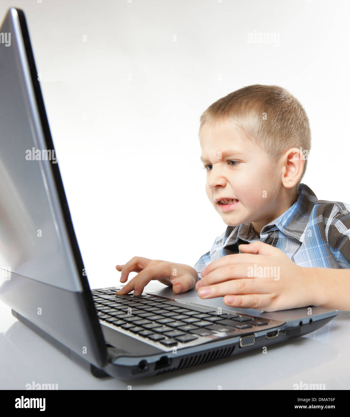 Computer addiction emotional child boy with laptop notebook playing ...