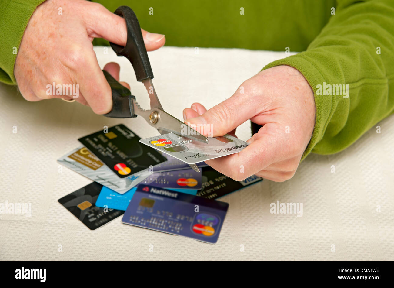 Cutting up money hi-res stock photography and images - Alamy