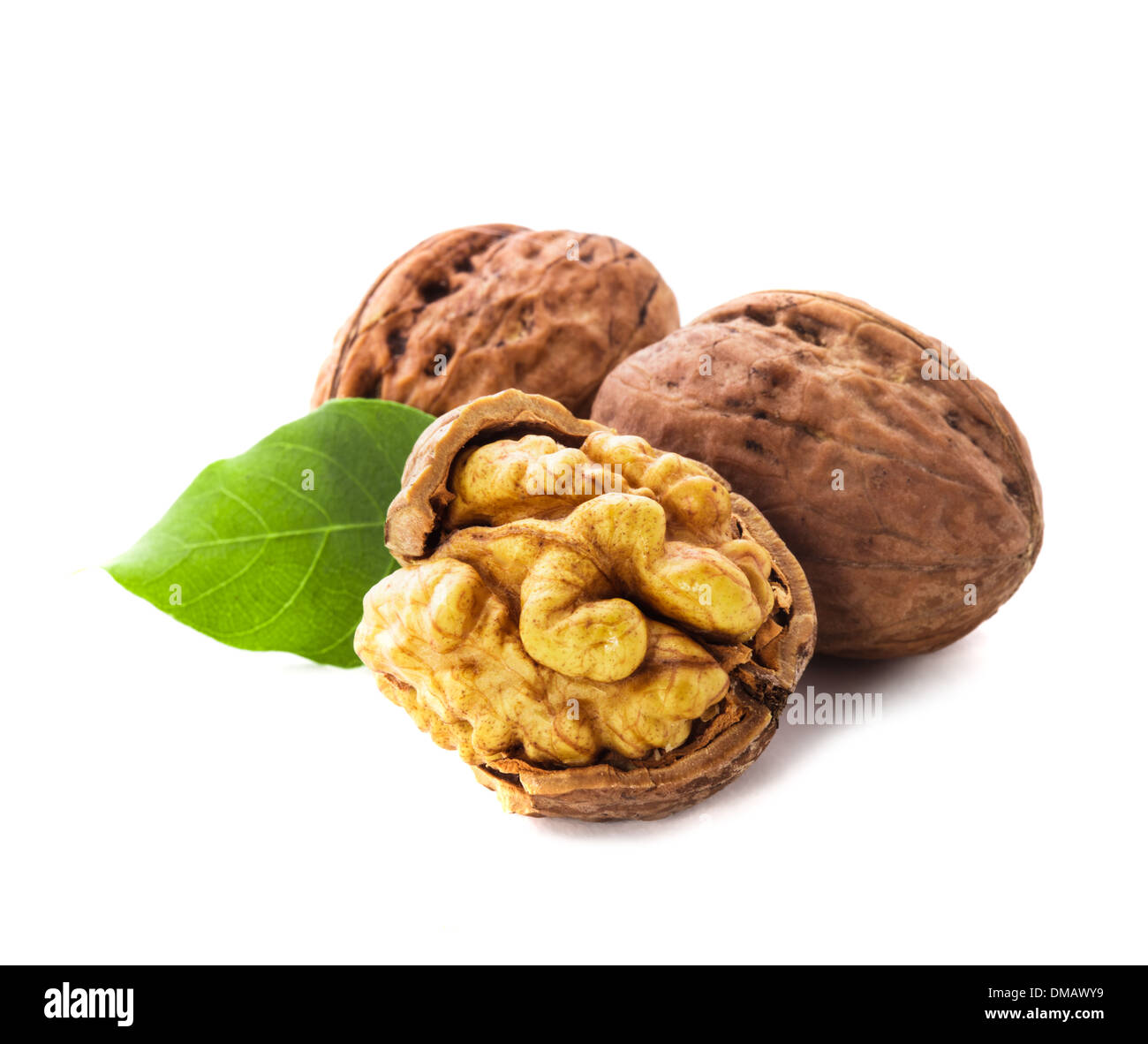 Walnuts with shell and green leaf isolated Stock Photo - Alamy