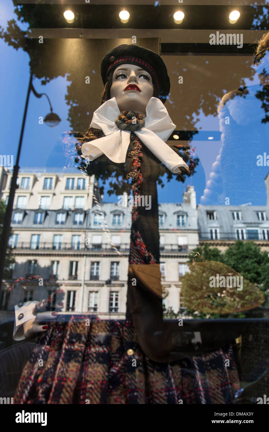 WINDOW OF THE CHANEL CLOTHING SHOP IN FRONT OF THE REFLECTIONS OF THE ...