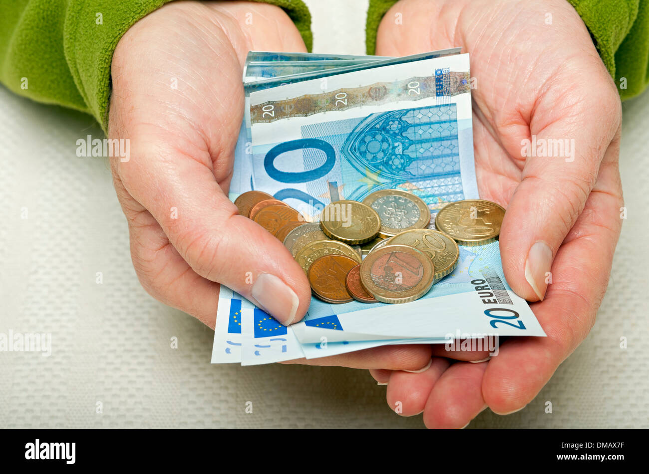 Close up of hand hands man person holding 20 twenty Euro euros notes ...