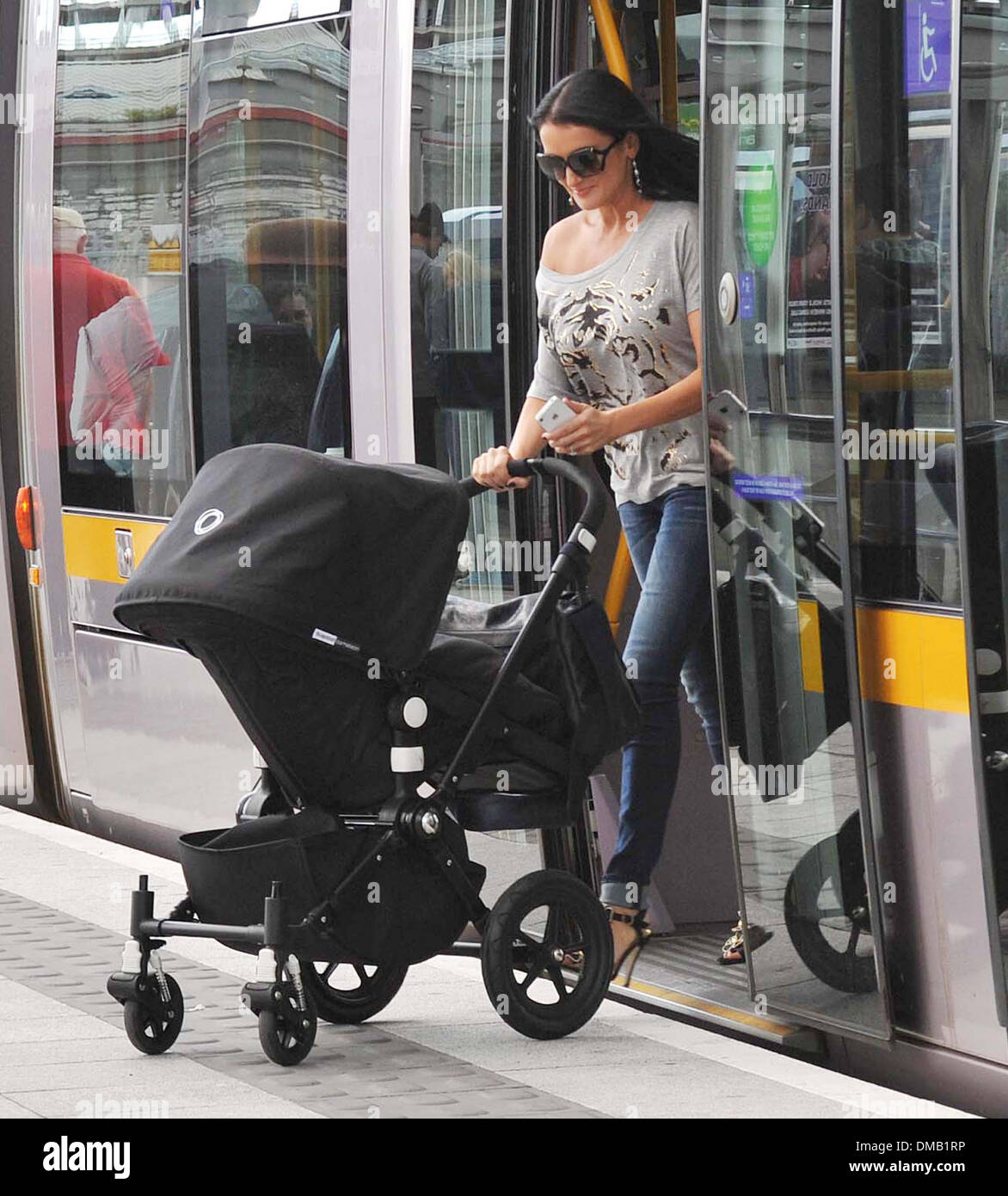 Virginia Macari and her son Thor arrive by tram filming of second ...