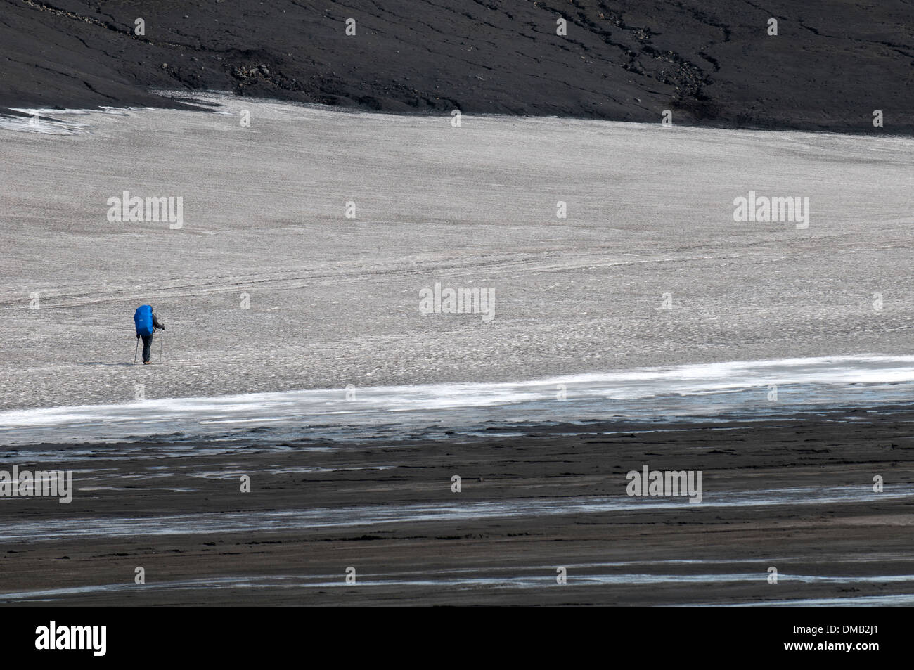 Hiker cross a snowfield, Landmannalaugar, Iceland Stock Photo - Alamy
