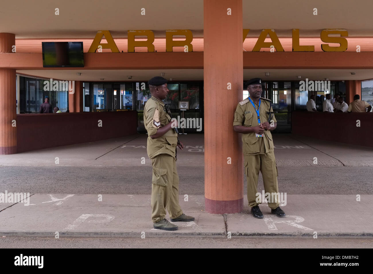 Members of the security force stand guard stand guard oat the entrance ...