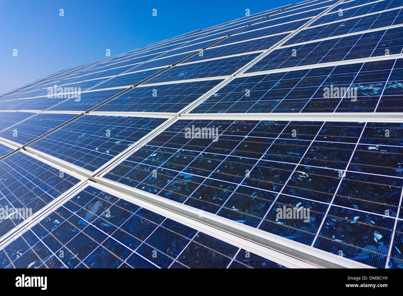 Blue photo-voltaic solar panels against a blue sky Stock Photo - Alamy