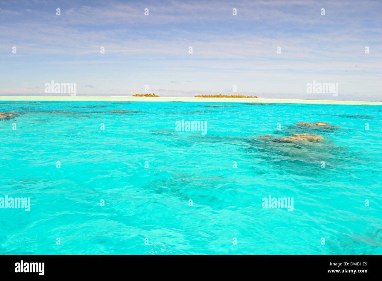 The colorful Aitutaki lagoon spotted by coral reef, in the middle of ...