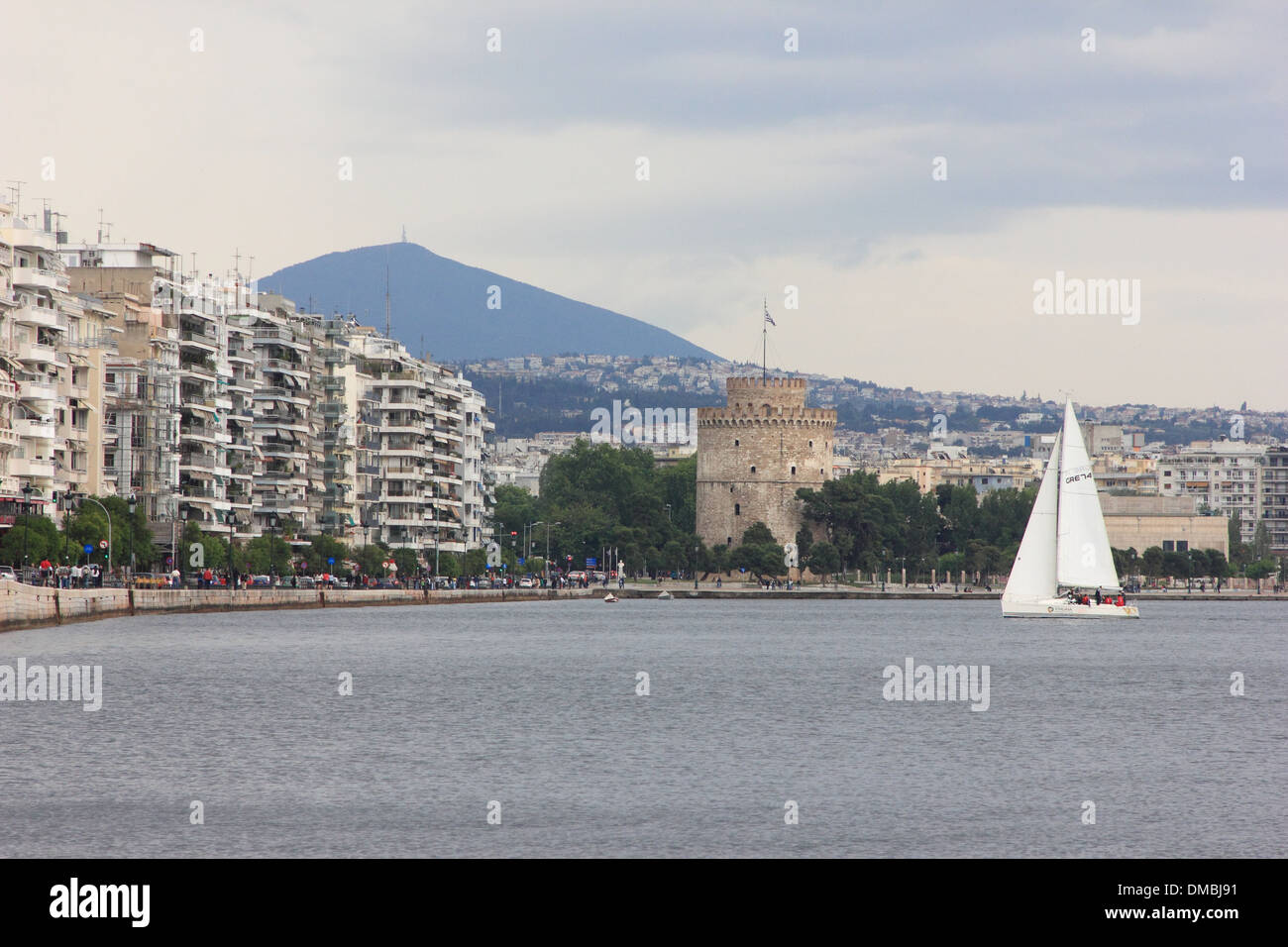 City at the sea with big buildings, landmark tower and sailing boat ...