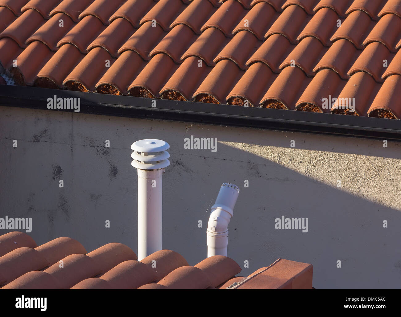 small metal chimney on a roof Stock Photo - Alamy