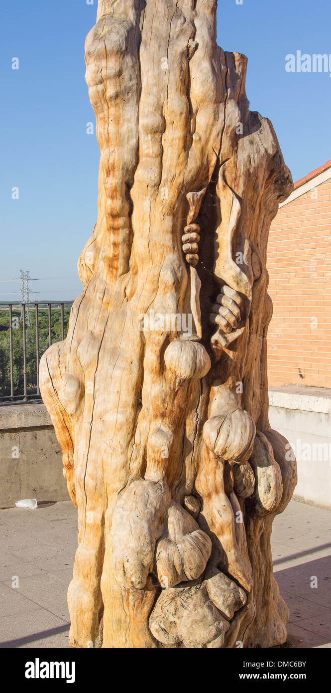 sculpture man emerging from inside a tree Stock Photo - Alamy