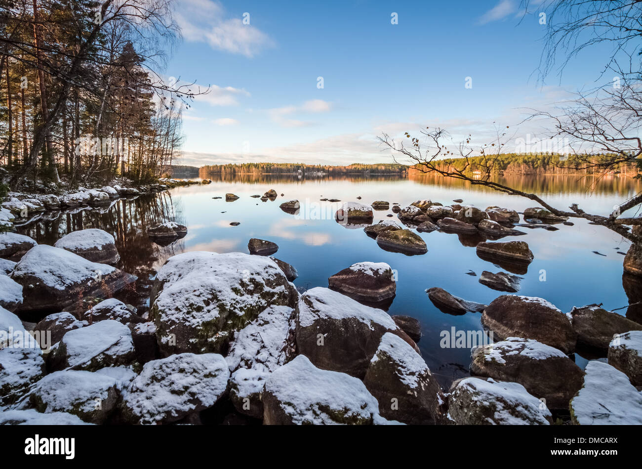 First snow on the rocks with stunning lake scene in Finland Stock Photo ...