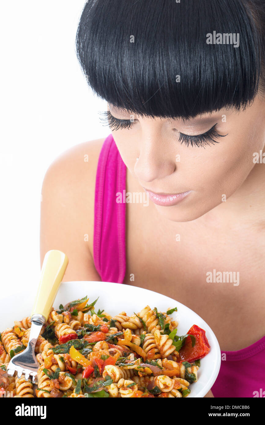 Young Woman Eating Pasta Salad Stock Photo - Alamy