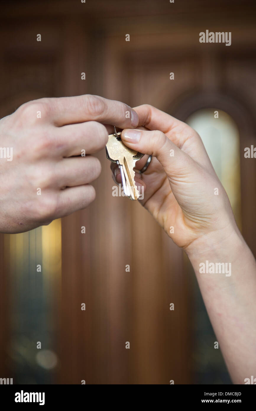 Handing keys over hi-res stock photography and images - Alamy