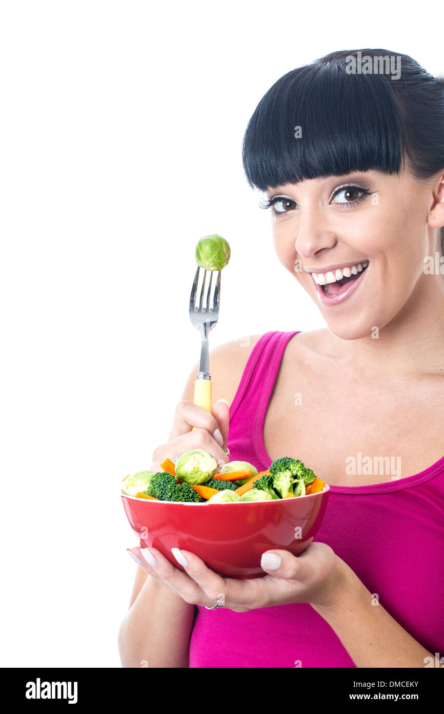 Young Woman Eating Vegetables Stock Photo - Alamy