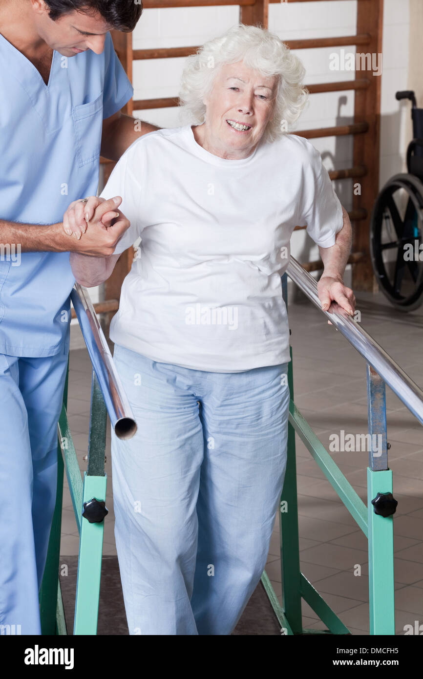 Doctor helping Patient Stock Photo - Alamy