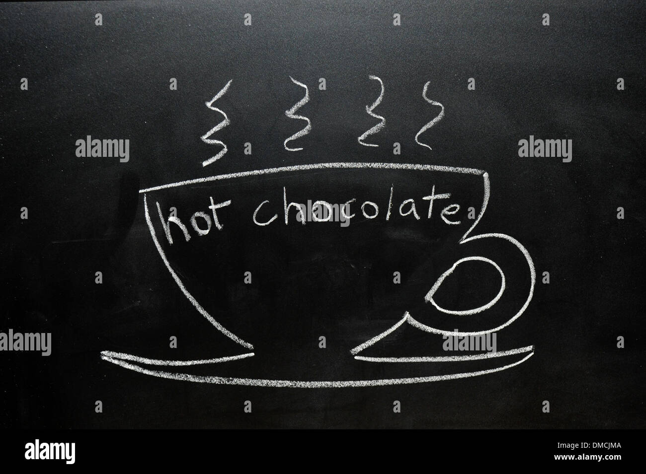 A cup with the word hot chocolate on it drawn on a blackboard in white ...