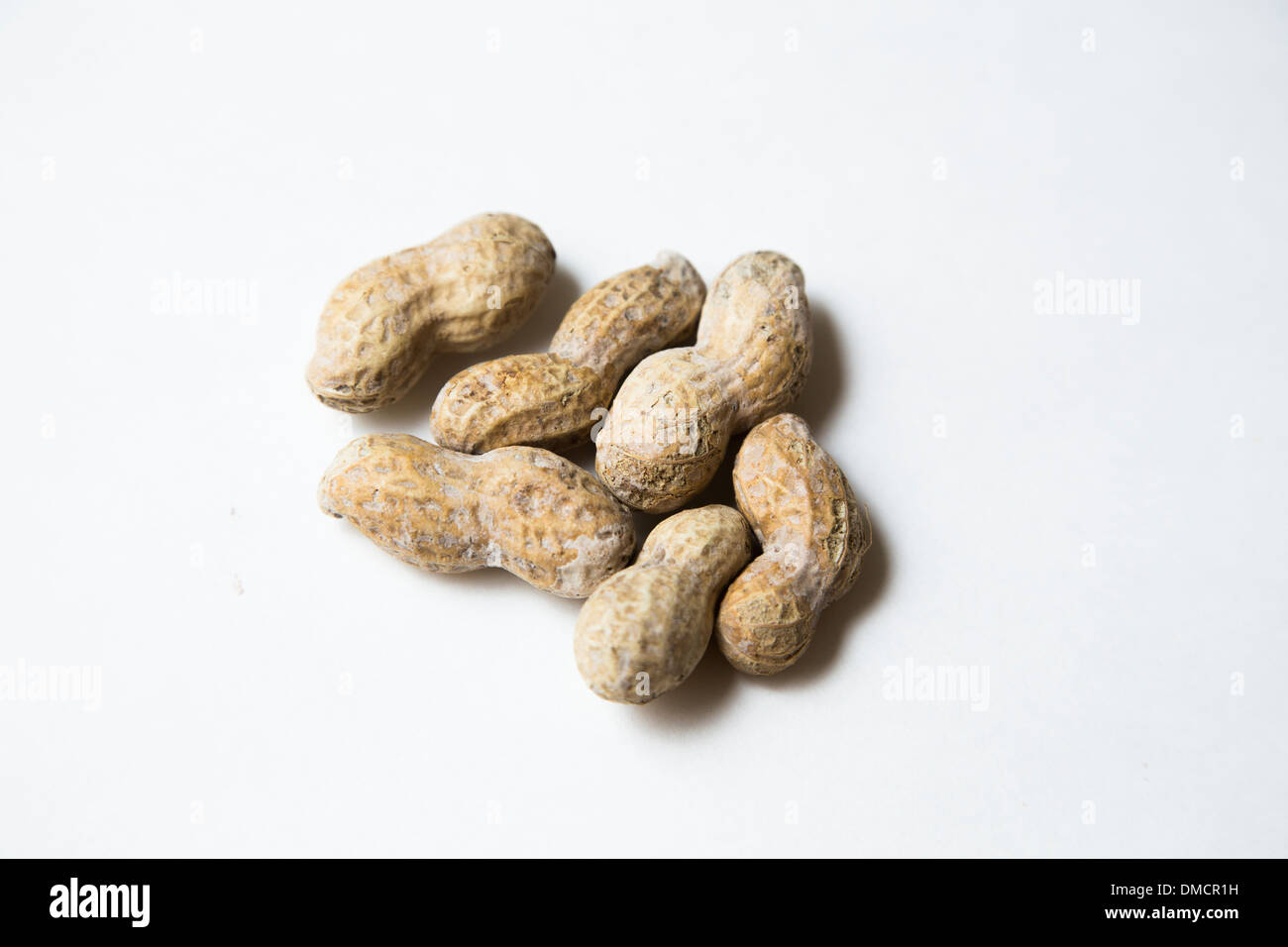 Group of peanuts on white background Stock Photo - Alamy