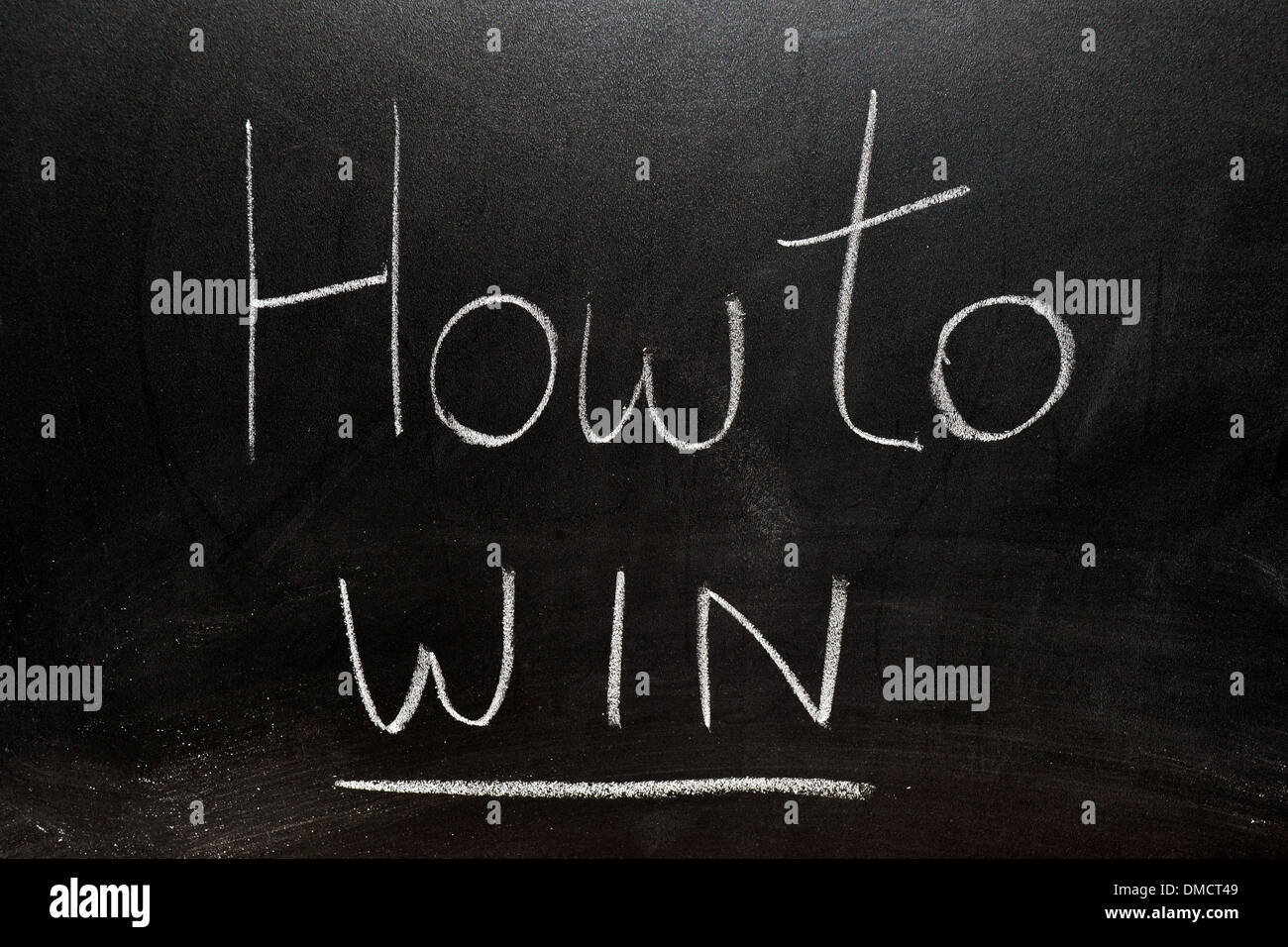 How to win drawn on a blackboard in white chalk Stock Photo - Alamy