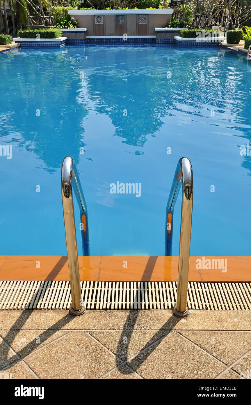 Swimming pool with stair at the hotel Stock Photo - Alamy