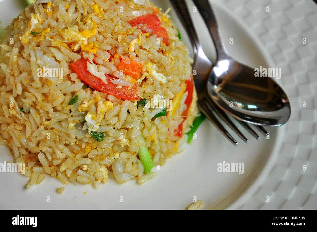 Fried rice with eggs and spoon and fork Stock Photo - Alamy