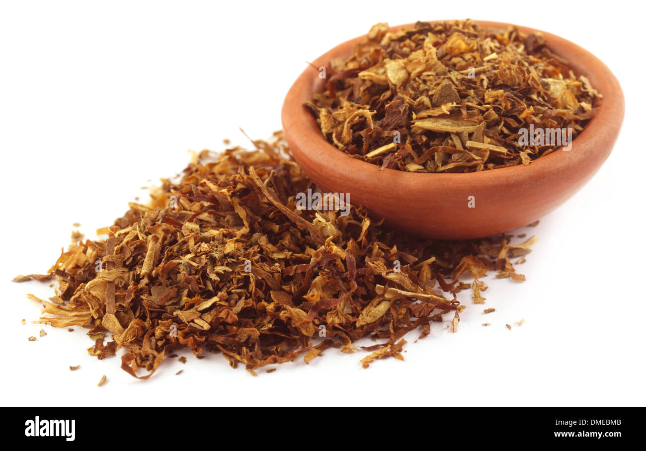 Tobacco for making cigarette on a small bowl over white background ...