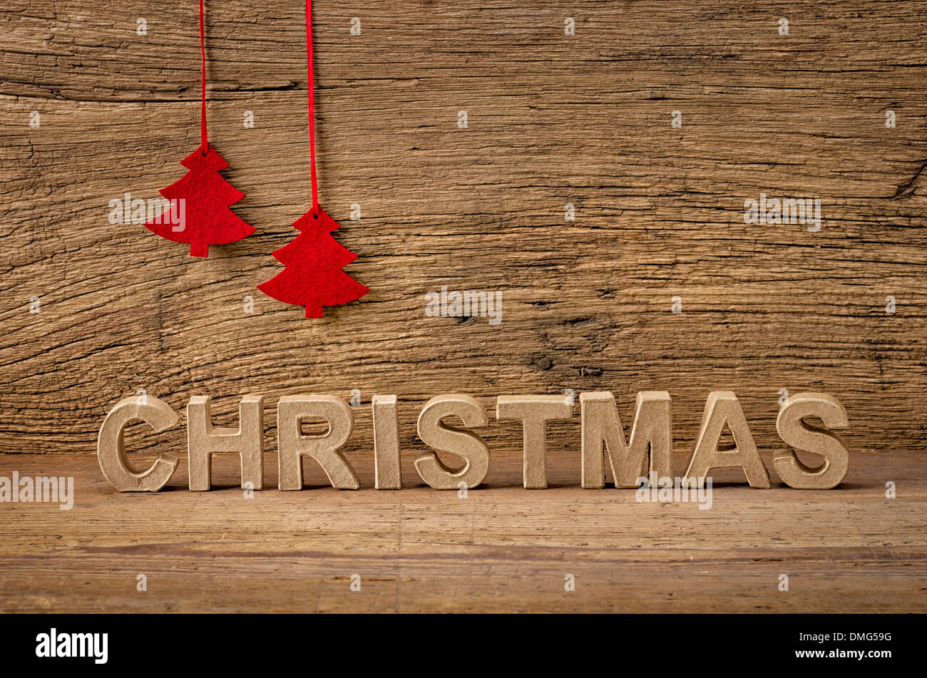 The word christmas in front of a rustic background Stock Photo - Alamy