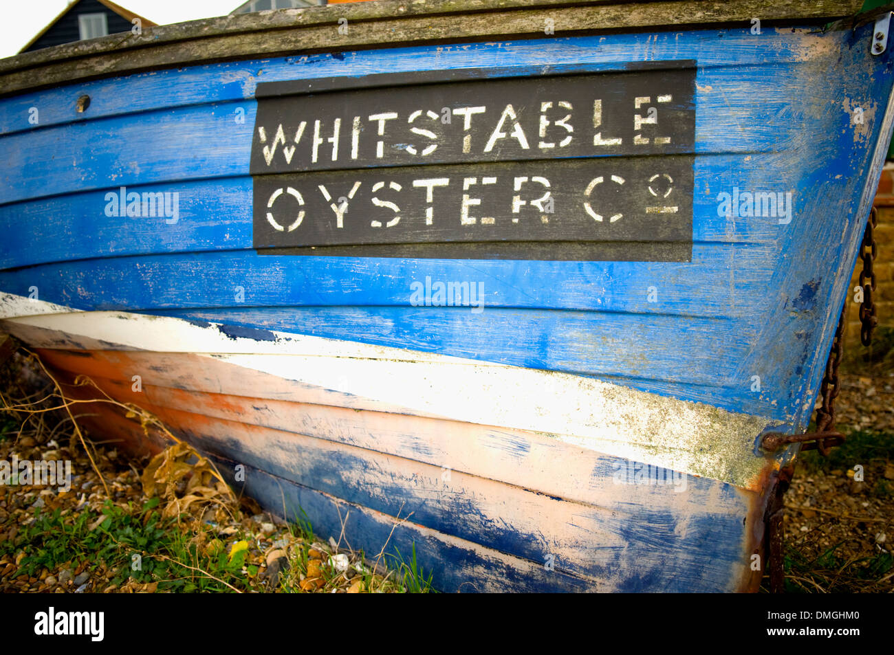 Colourful boat on beach at Whitstable Stock Photo - Alamy