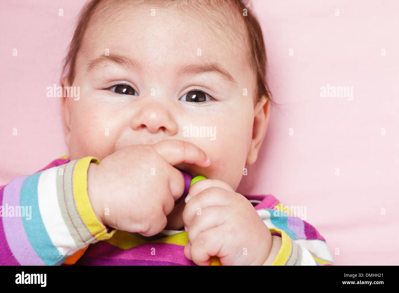 Smiling and playing baby with teething ring. Closeup face Stock Photo ...