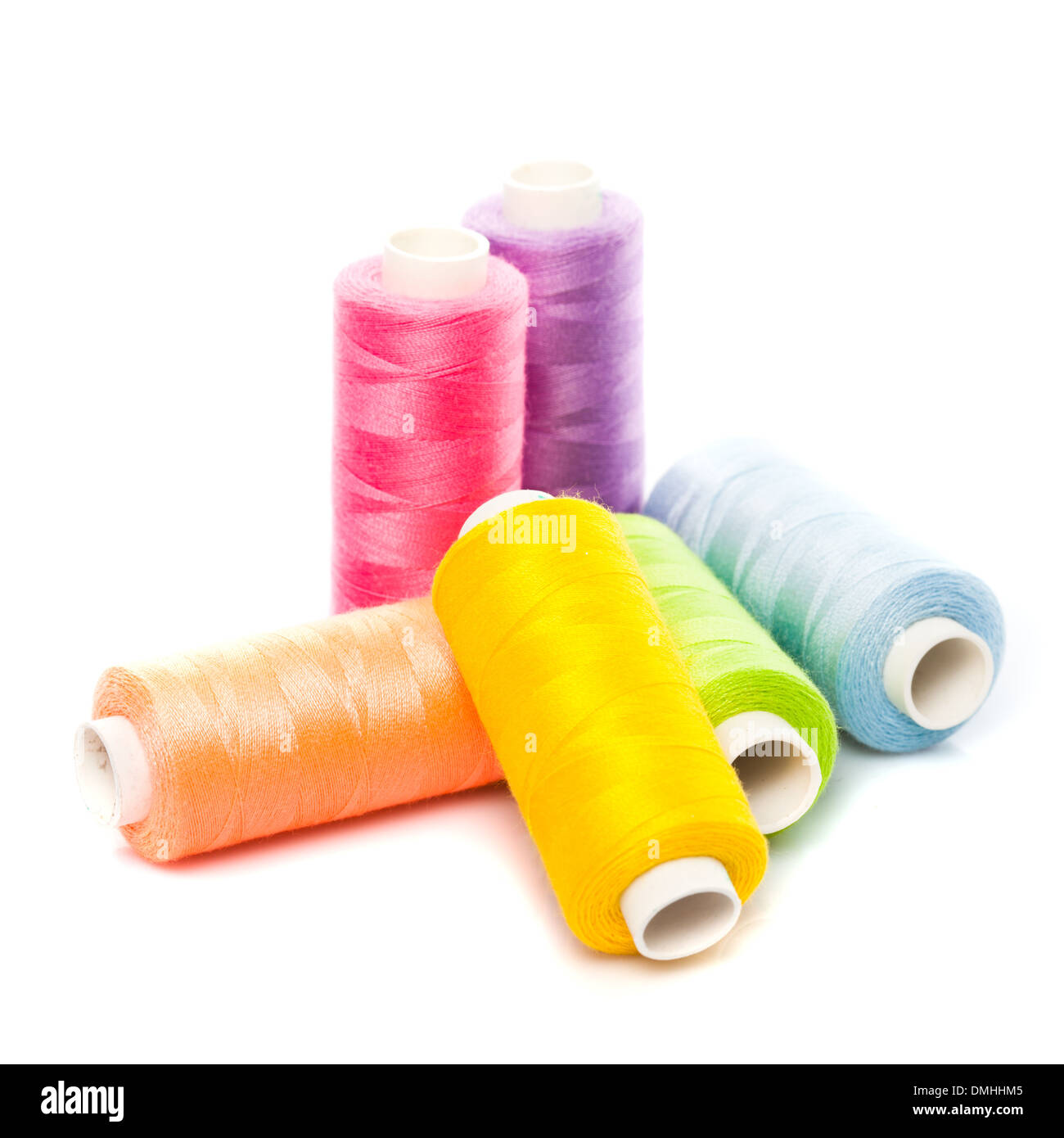 Sewing multicolored threads isolated on white Stock Photo - Alamy