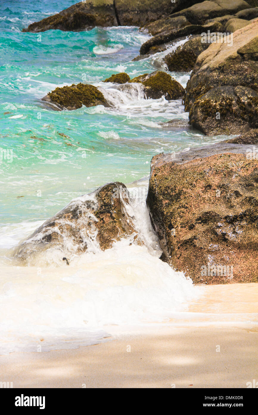 Large smooth stones with turquoise water on the paradise island of ...