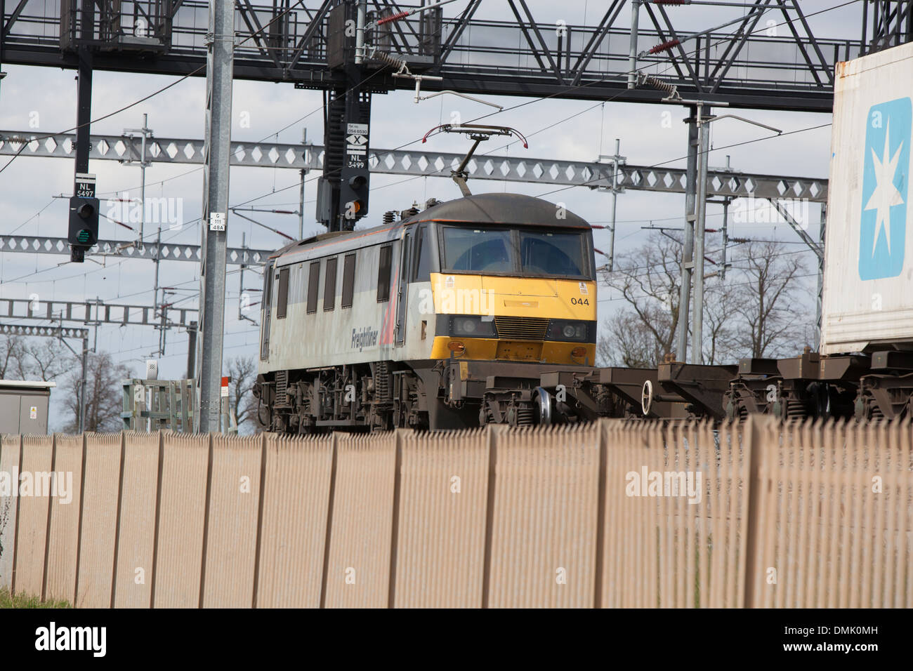 A freight train on the West Coast Main Line in the Midlands Stock Photo ...