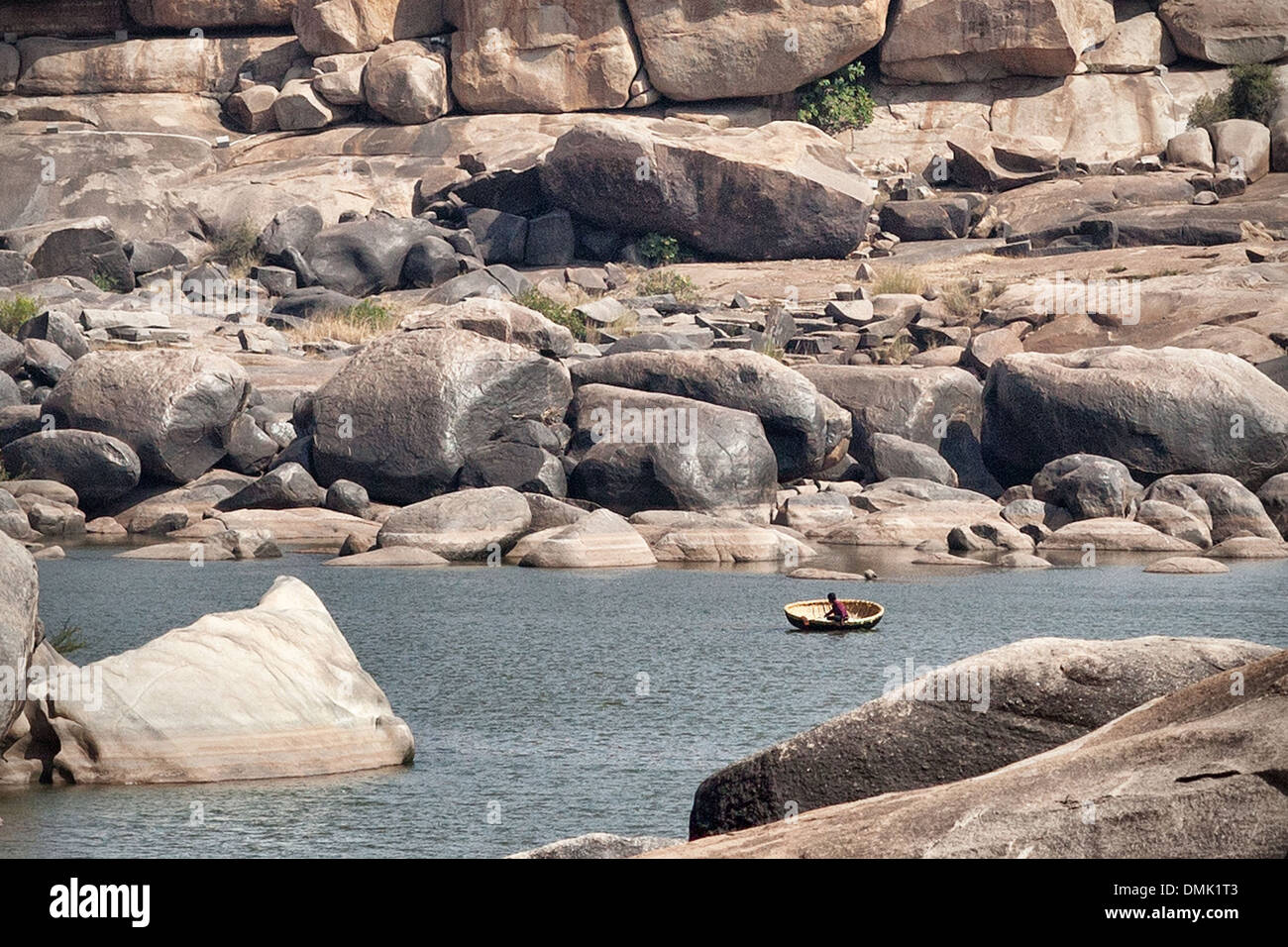 SMALL TRADITIONAL ROUND BOAT ON THE RIVER IN HAMPI, KARNATAKA, INDIA ...