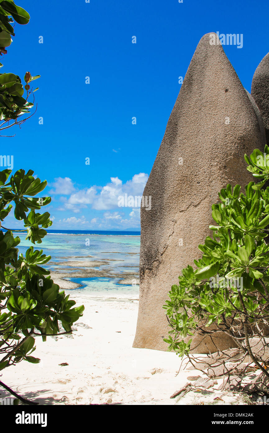 Exotic lagoon between large smooth rocks in the Seychelles Stock Photo ...