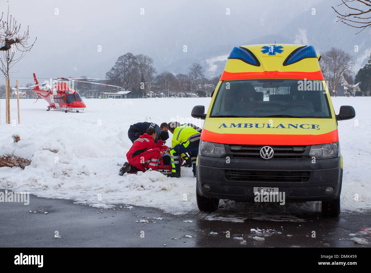 RESCUERS CARRYING OUT AN EVACUATION BY HELICOPTER AT THE INTERLAKEN SKI ...