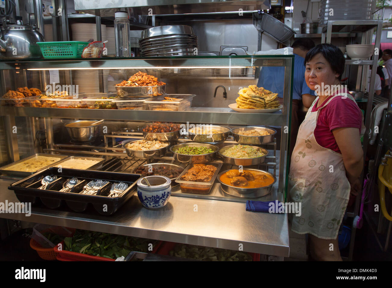 THE COOK IN A HAWKER CENTRE, OR STREET STAND, WHERE YOU CAN LUNCH ...