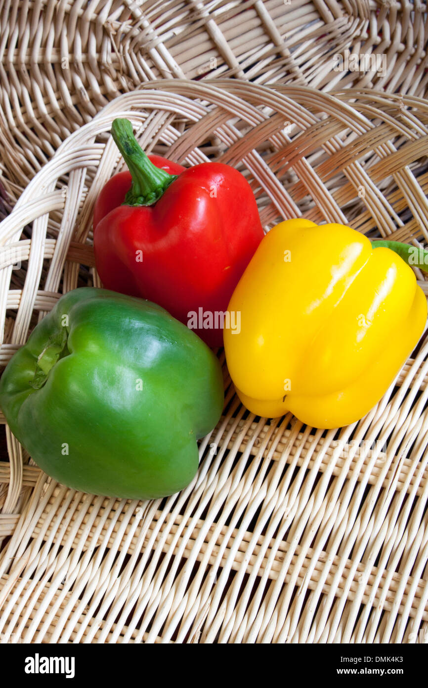 3 peppers in a wicker basket Stock Photo - Alamy