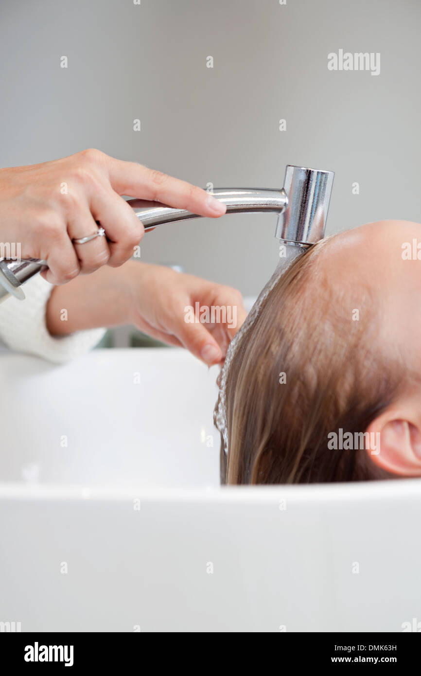 Woman Getting Hair Washed At Salon Stock Photo - Alamy