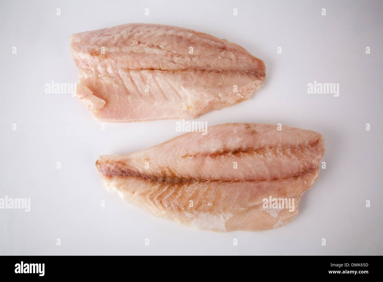 Frozen fish products laid on ice to be showcased for consumption ...