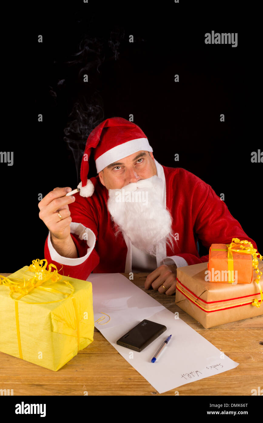 Santa smoking hi-res stock photography and images - Alamy
