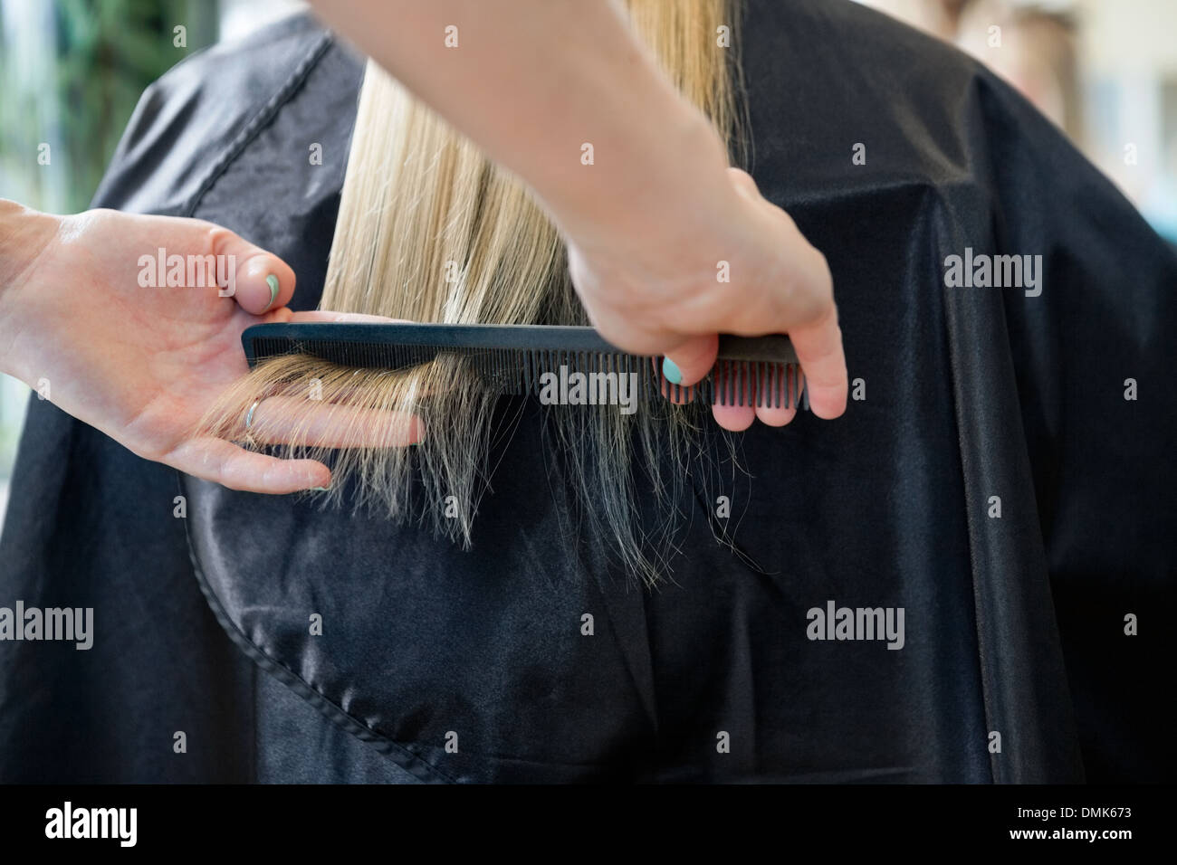 Woman combing hair cropped hi-res stock photography and images - Alamy