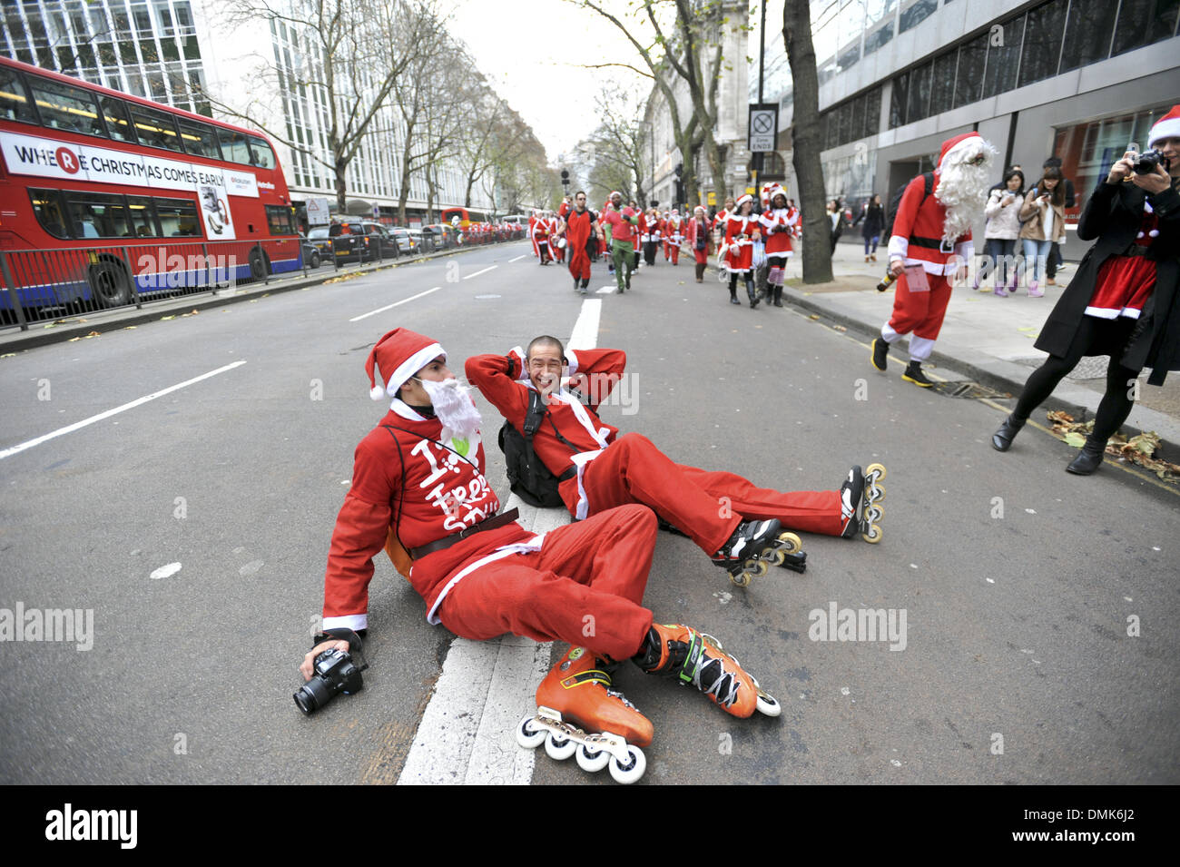 London, UK. 14th December 2013. 'Santacon', a Santa Claus parade ...